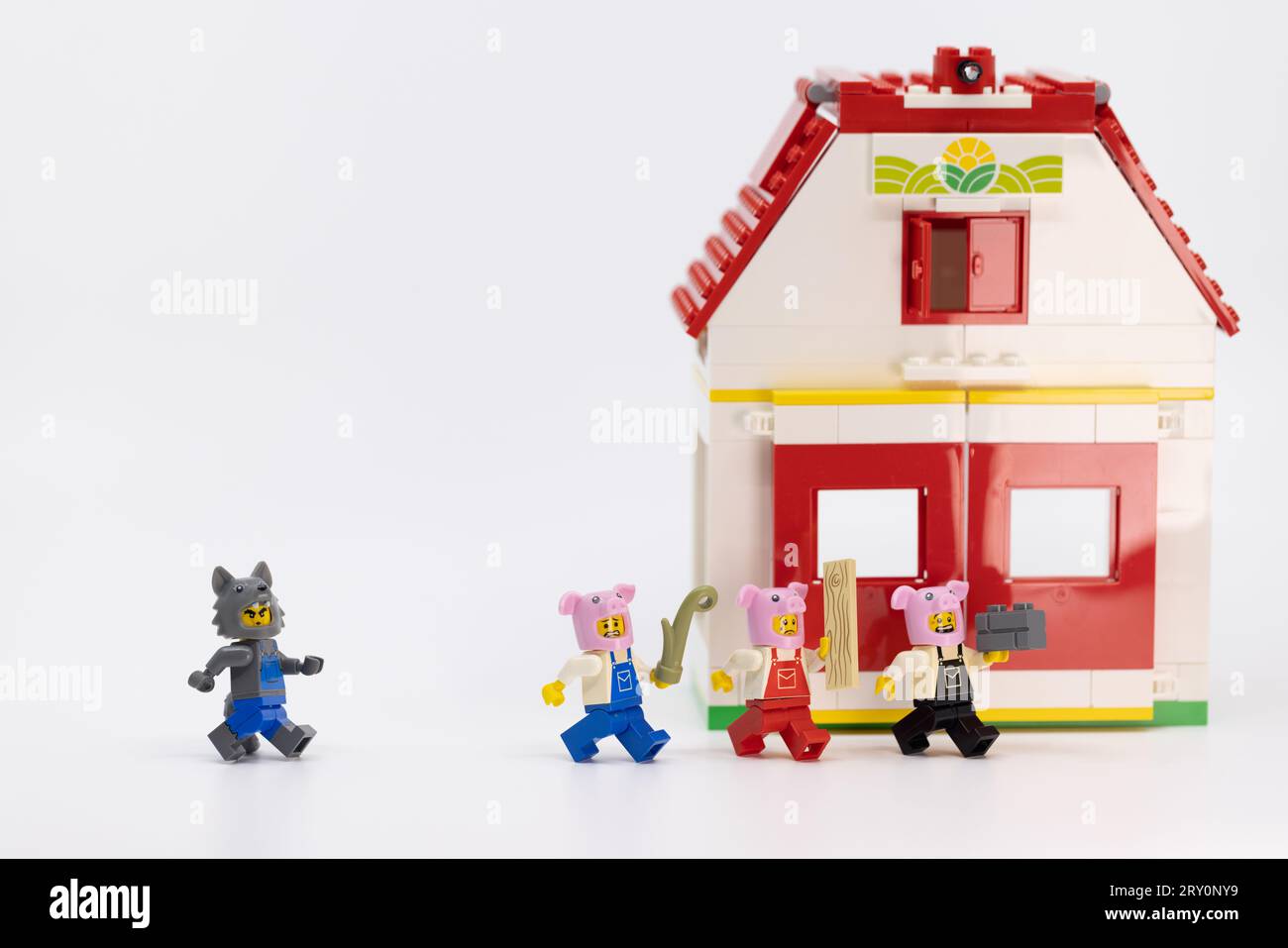 three little piggies run away from the big bad wolf Stock Photo - Alamy