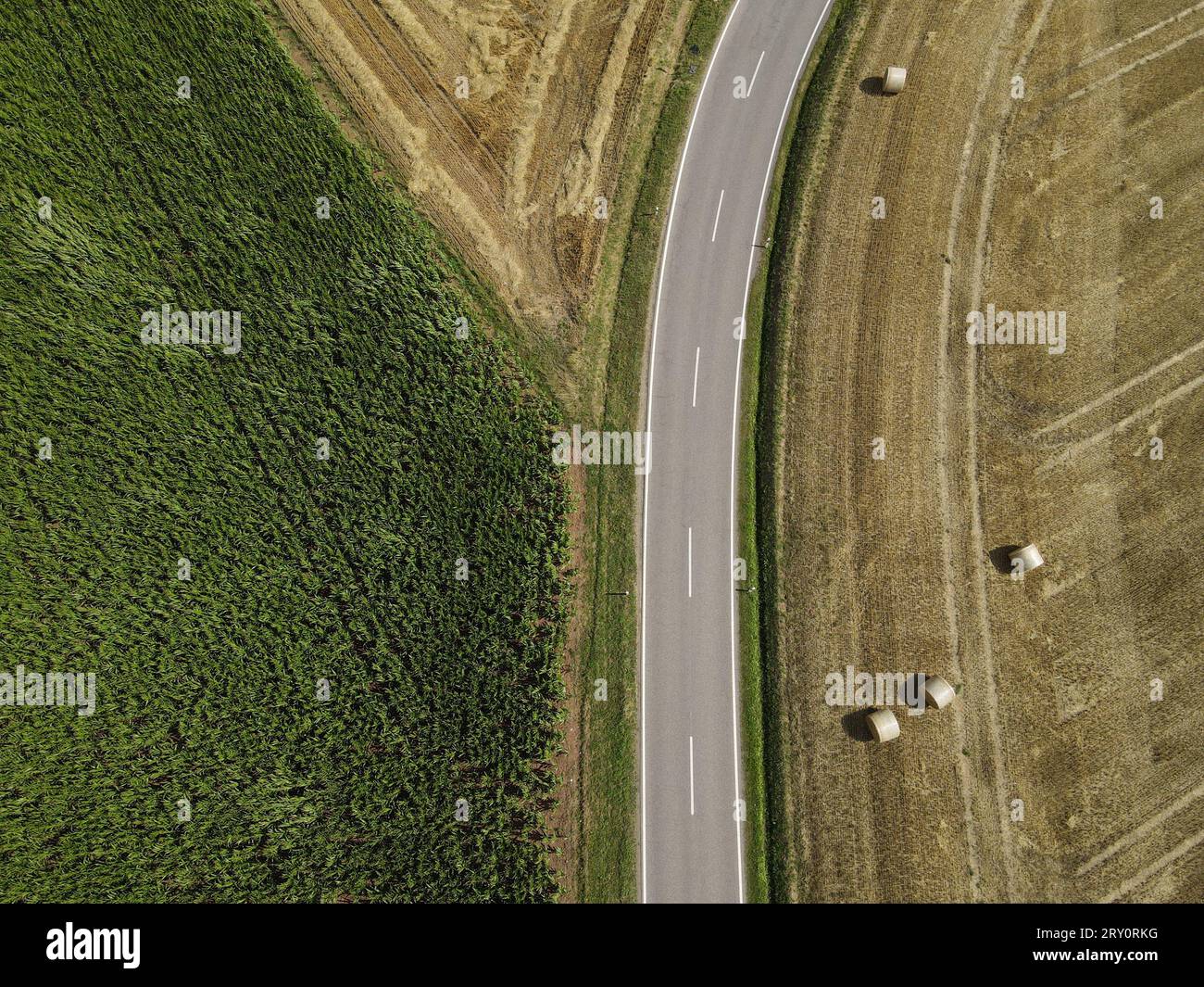 Road between agriculture fields in the landscape from above Stock Photo ...