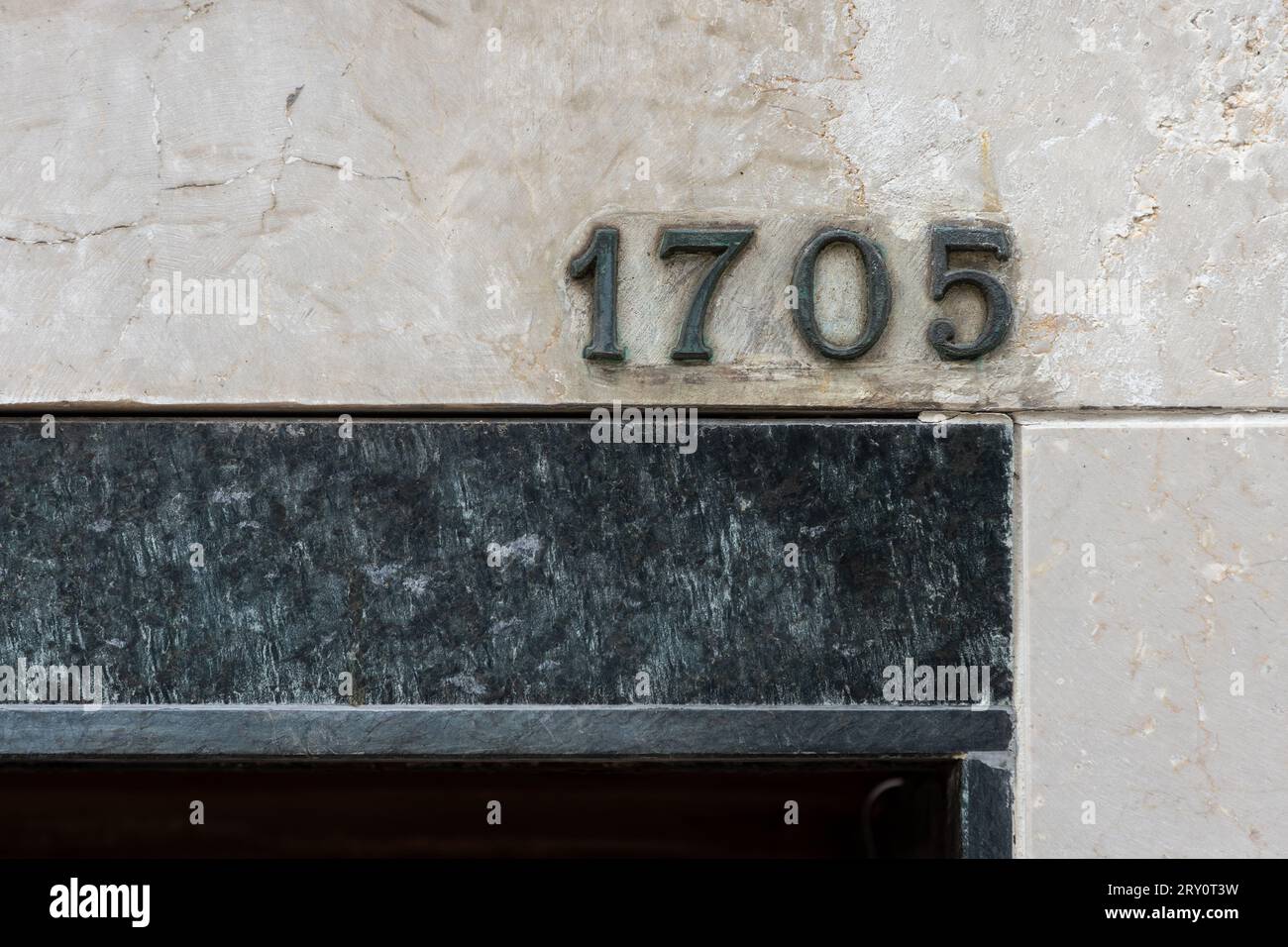 one thousand seven hundred five metal ancient house number, concept ...