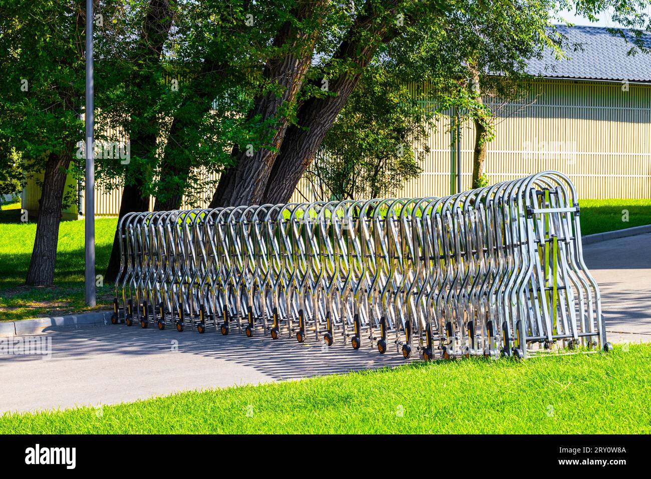 movable metal railing on wheels on the street Stock Photo - Alamy
