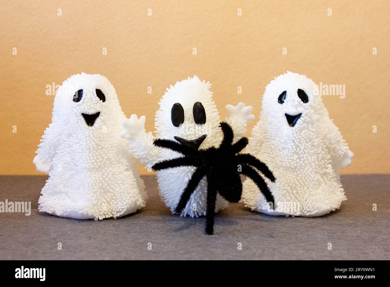 Happy ghosts with spiders celebrating trick or treat on Halloween day ...