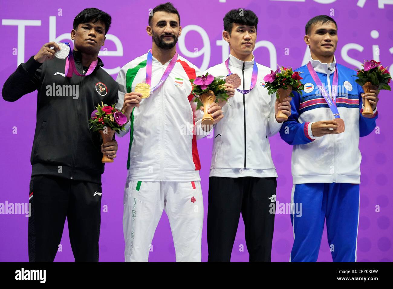 Gold medalist Iran's Afshin Salimi Toupghara, second left, poses on the ...