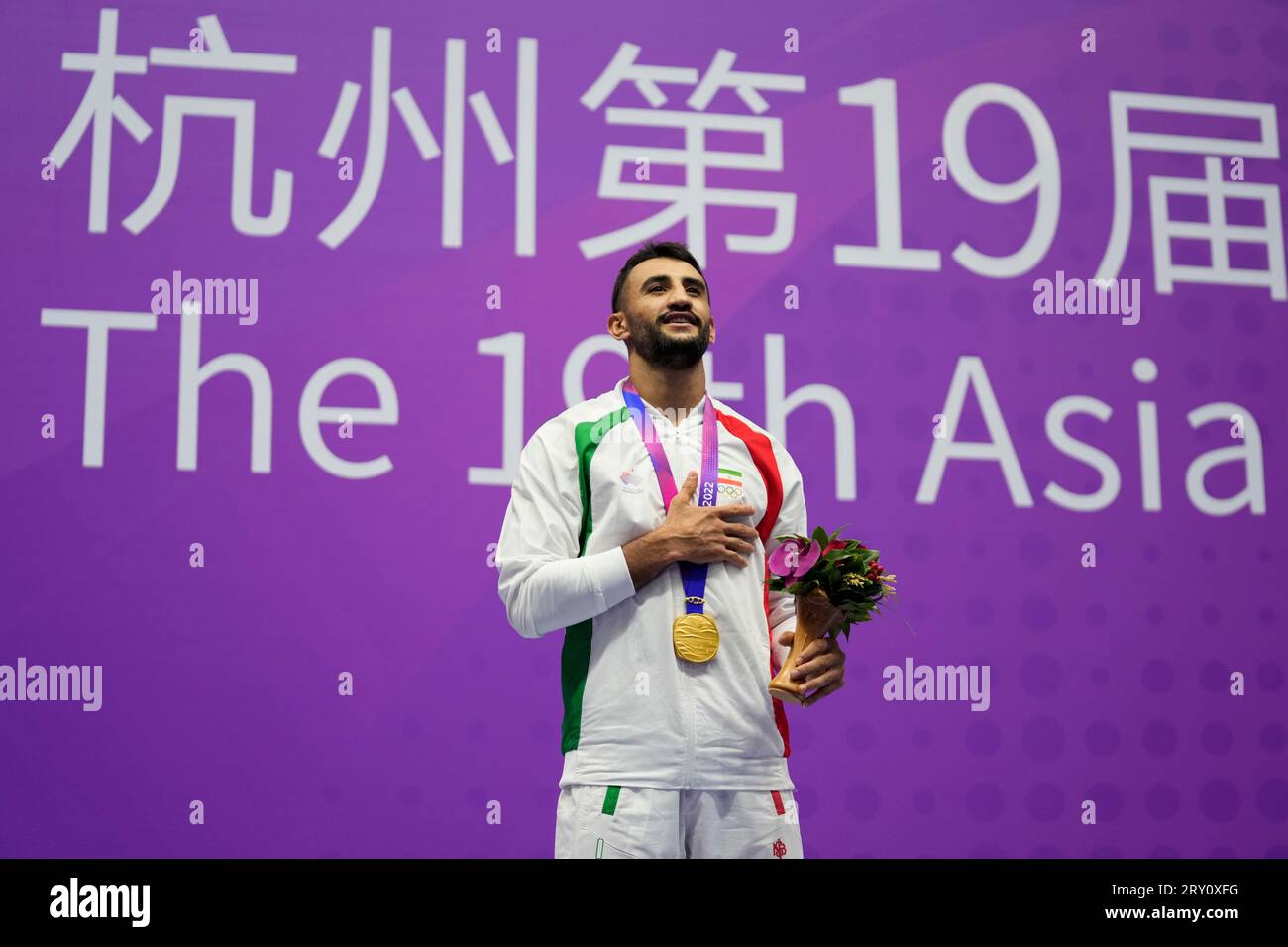 Gold medalist Iran's Afshin Salimi Toupghara stands for his country's ...