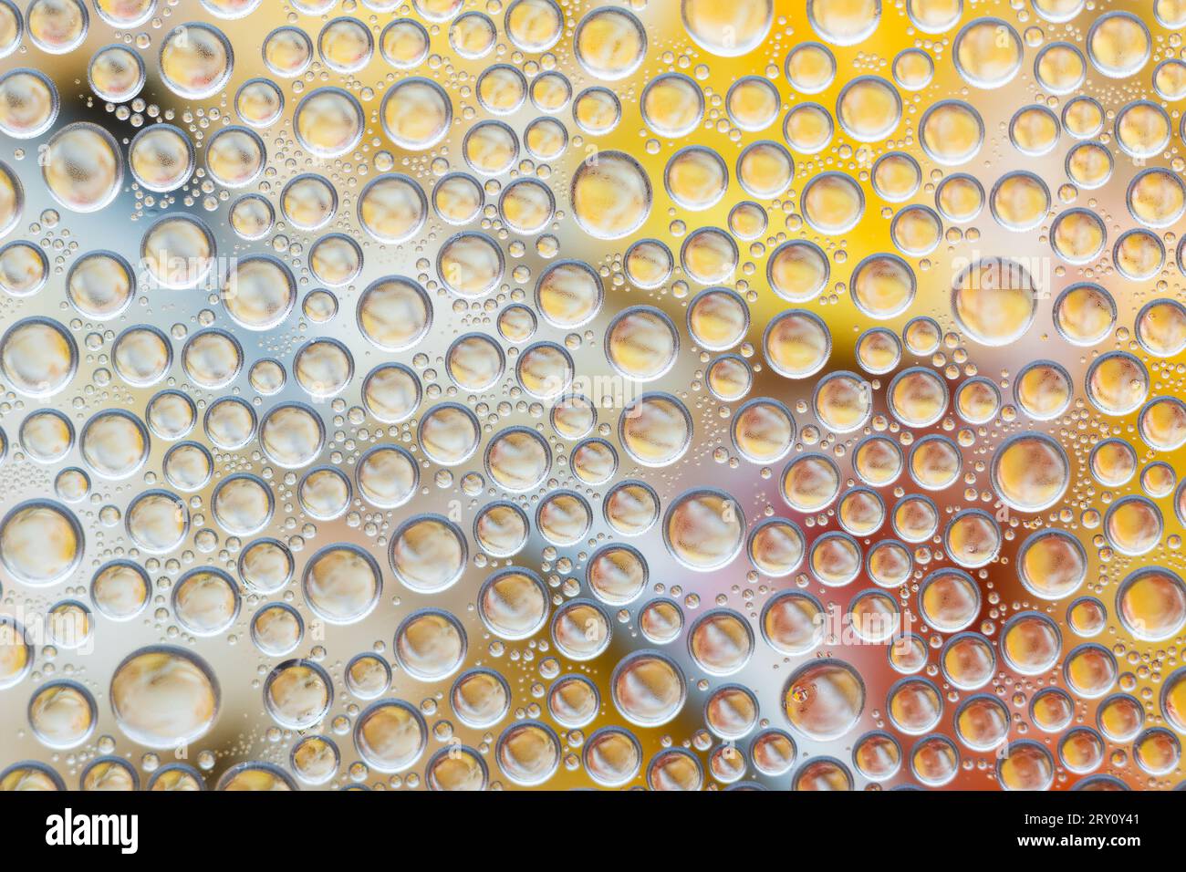 Water drops on glass surface with colorful background Stock Photo - Alamy