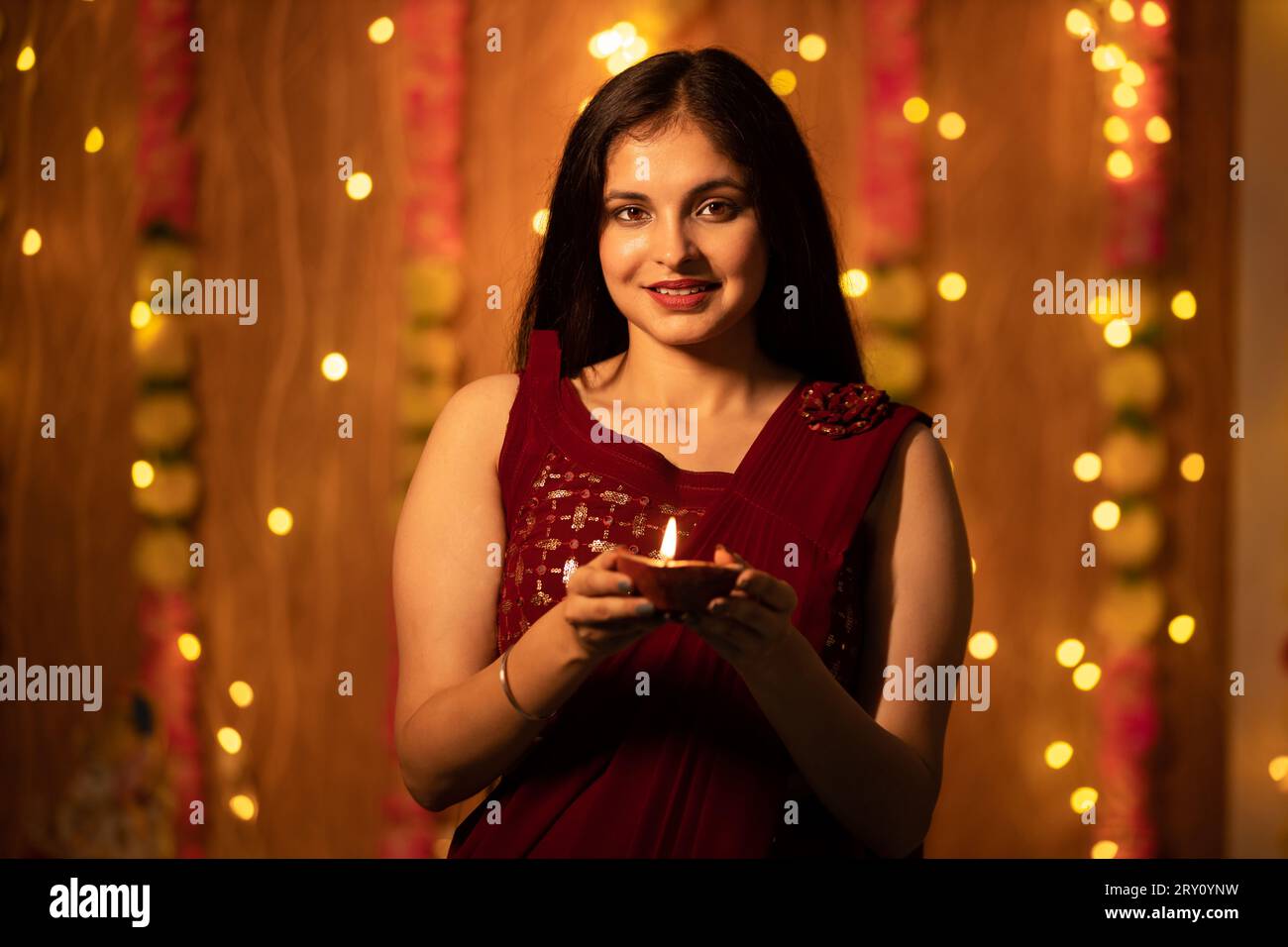 Portrait of a beautiful young smiling Indian woman in traditional dress ...