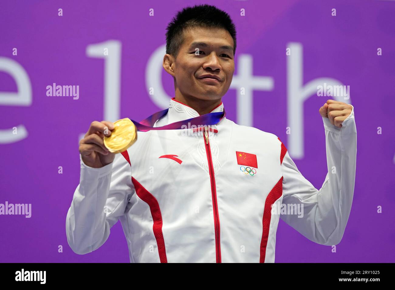 Gold medalist China's Haidong Jiang poses on the podium during the ...
