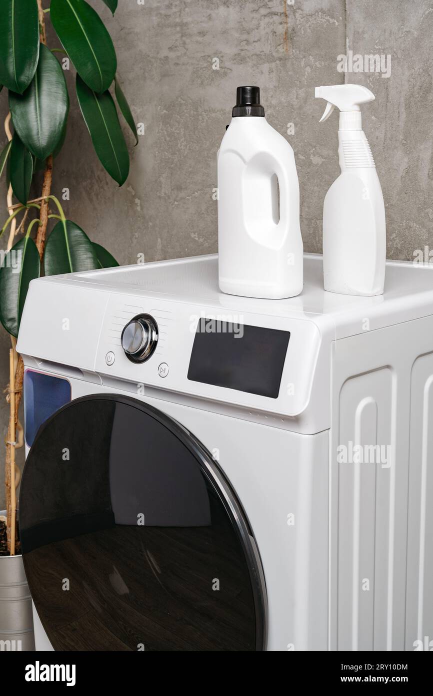 Washing liquid detergents on washing machine in a laundry room Stock ...