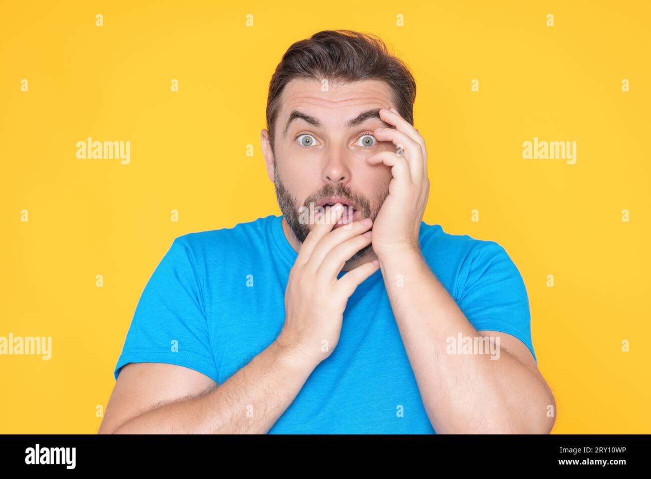 Emotional scared man looks with frightened expression, nervously ...