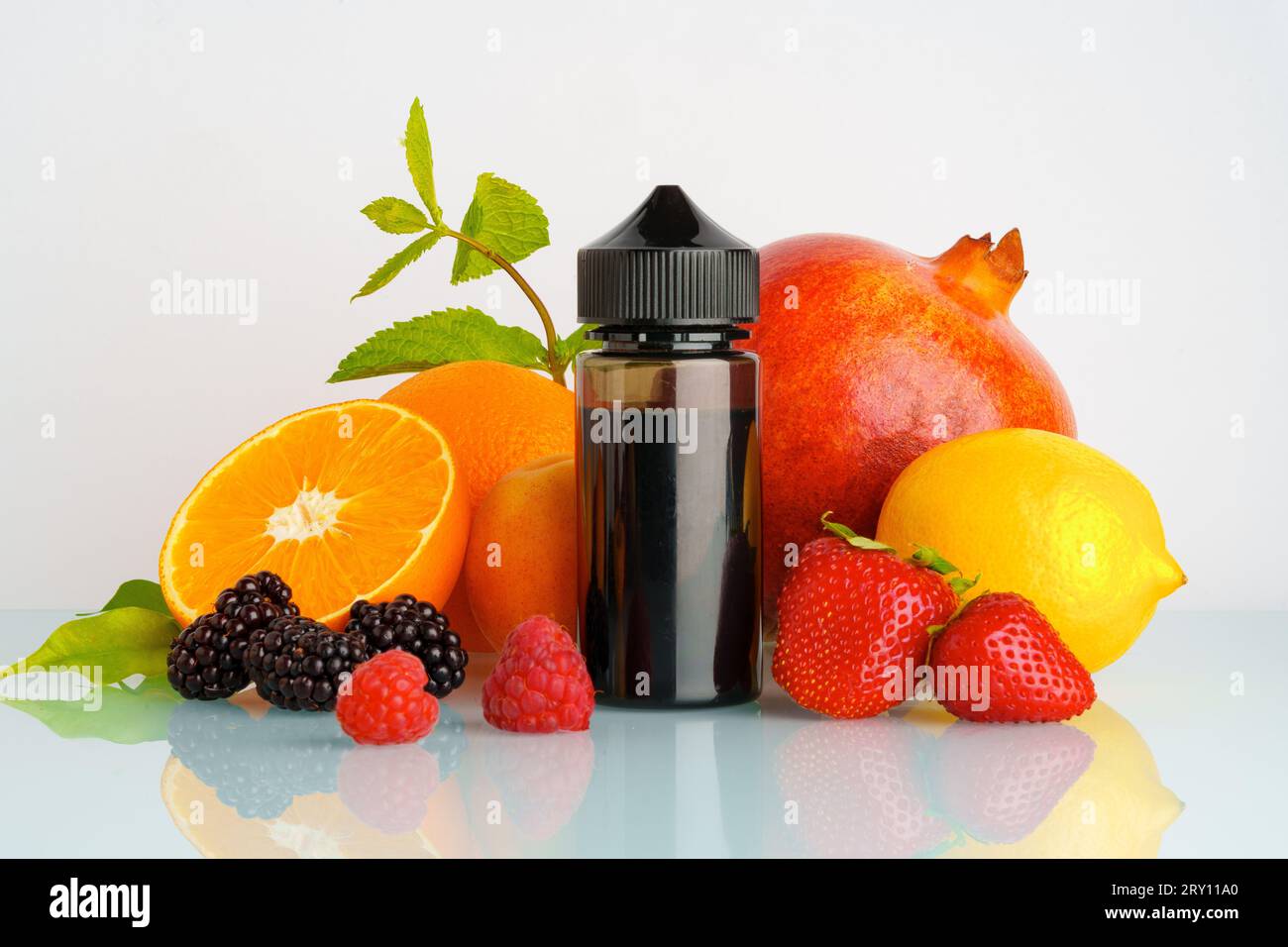 Vape and smoking liquid with fruit flavor on white background Stock ...