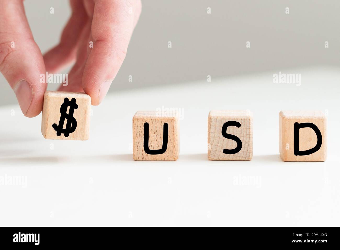 Word USD. Wooden small cubes with letters isolated on white background ...