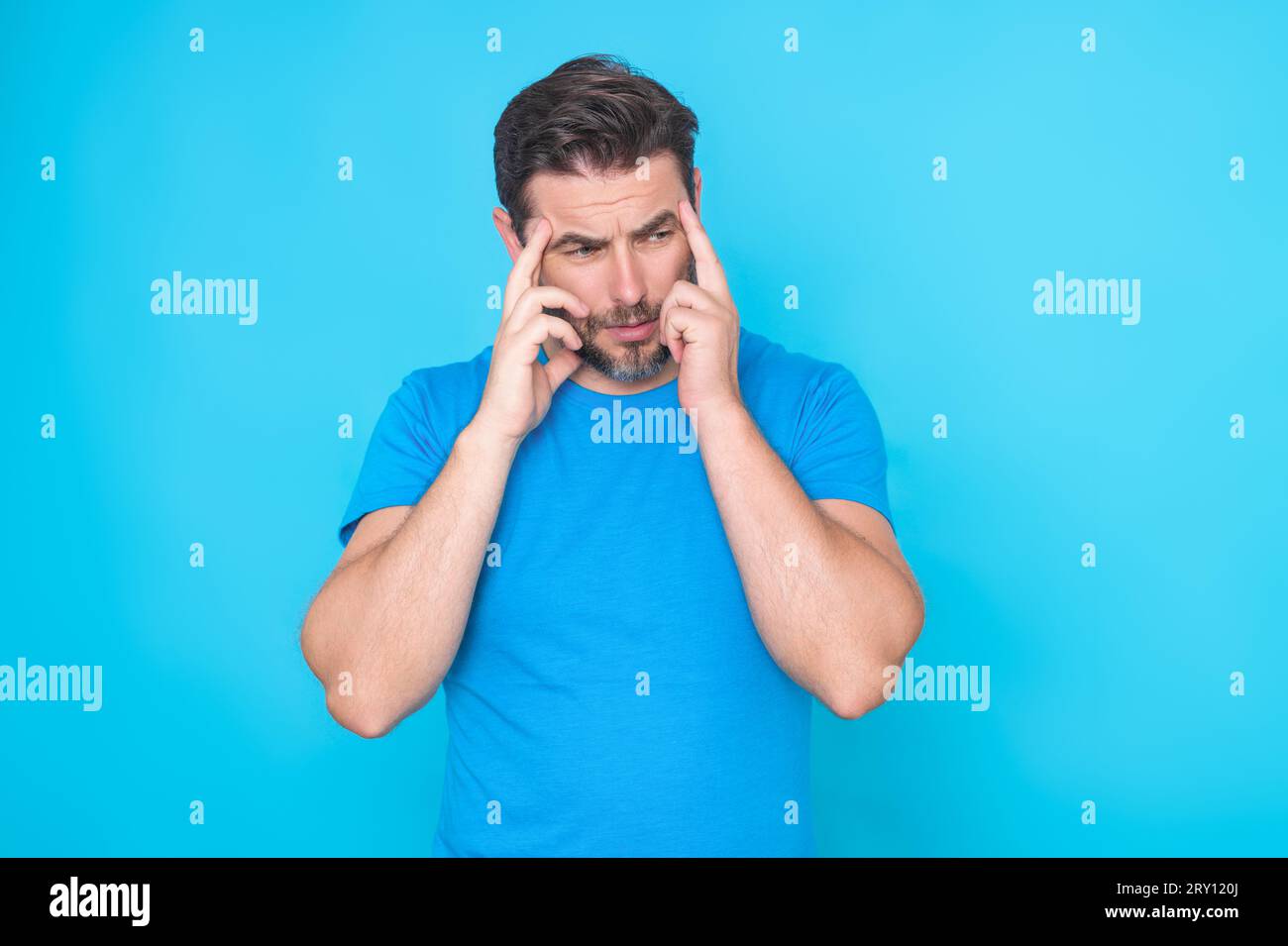 Thinking concept. Portrait of focused smart and creative man, holding ...