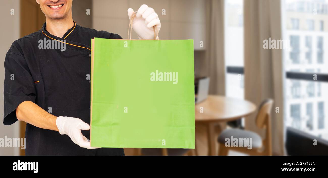 Courier holding paper bags with food, space for text. Delivery service ...