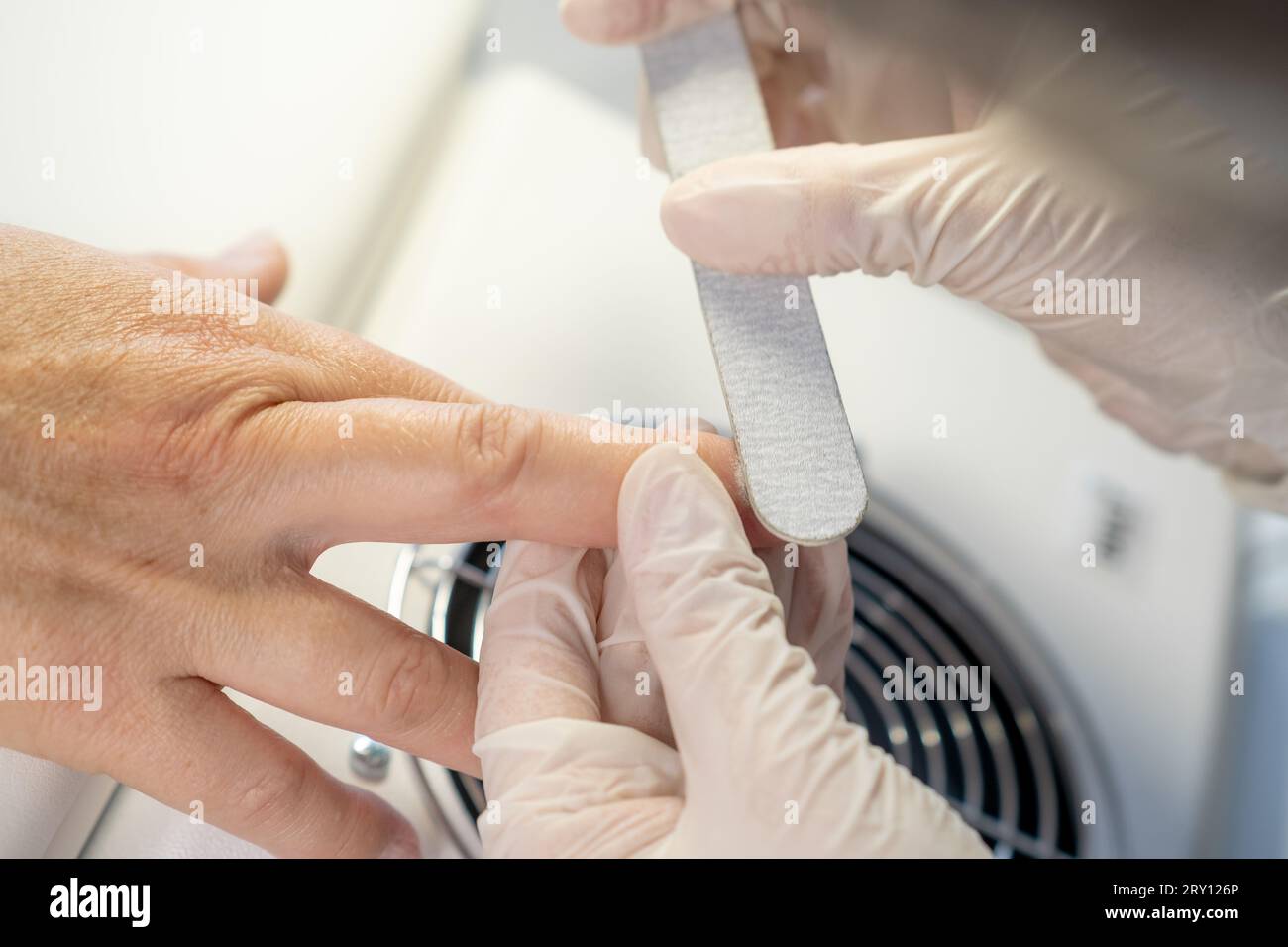 Female hands and tools for manicure, process of performing manicure ...