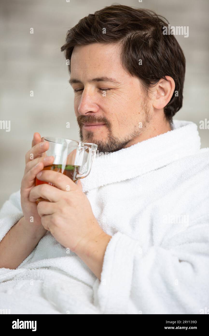 Caucasian man in robe drinking hi-res stock photography and images - Alamy