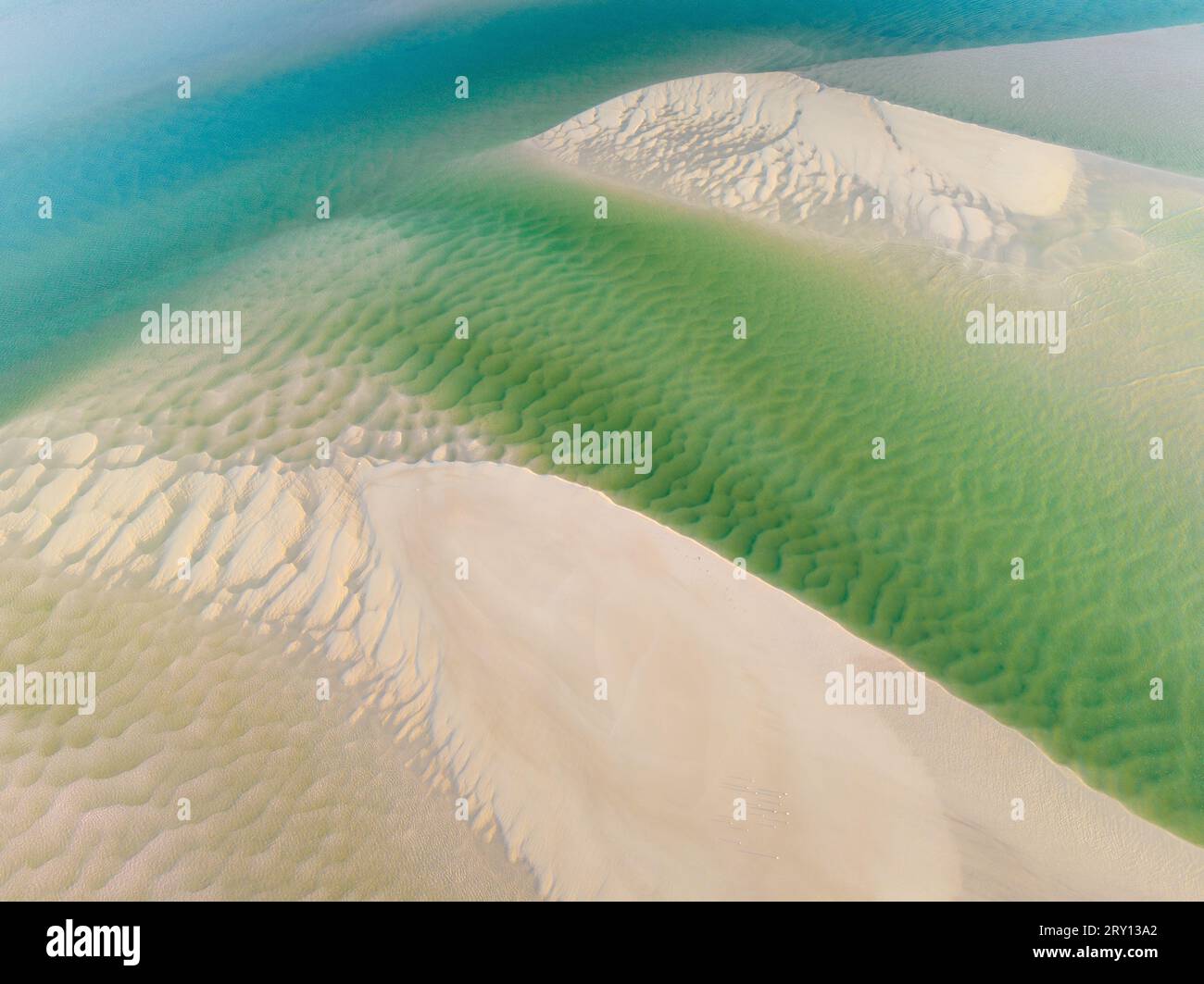 Aerial view of shallow seawater flowing over tidal sand bars at ...