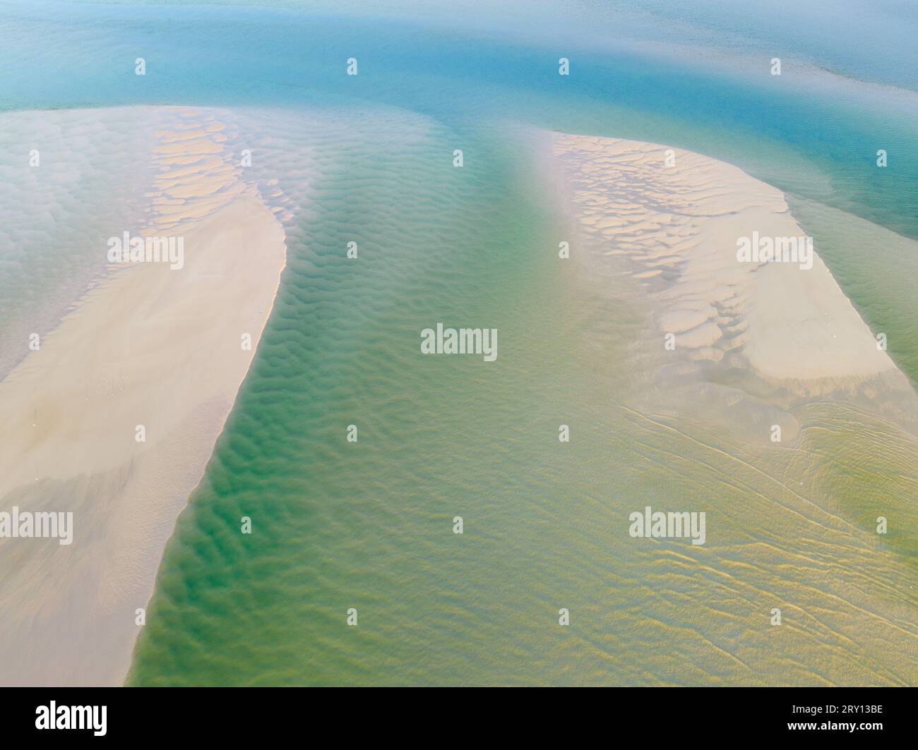 Aerial view of shallow seawater flowing over tidal sand bars at ...