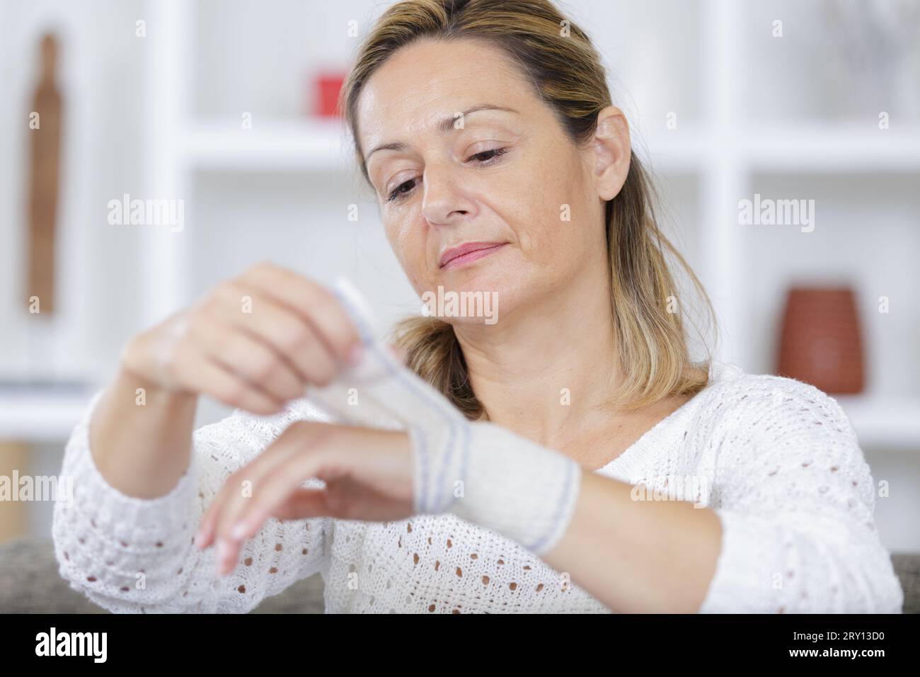 a woman with injured hand Stock Photo - Alamy