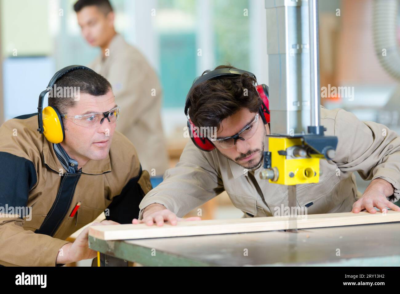woodworking teacher supervising his apprentice Stock Photo - Alamy