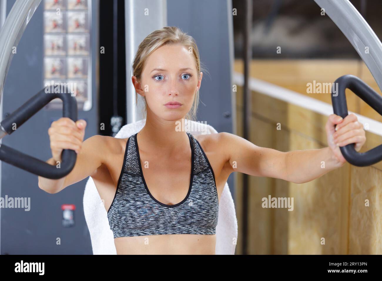 a woman training her pectorals Stock Photo - Alamy