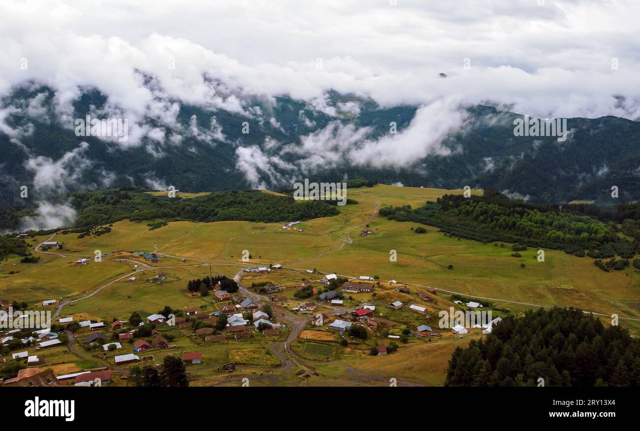 Aerial view of rural village Omalo in Georgia surrounded by mist high ...