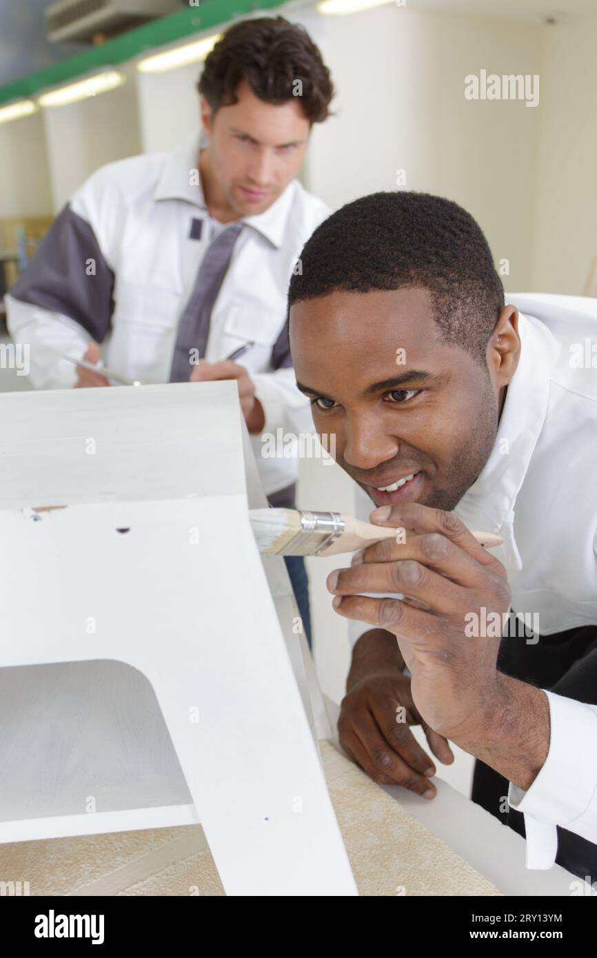 Group builders in overalls hi-res stock photography and images - Alamy