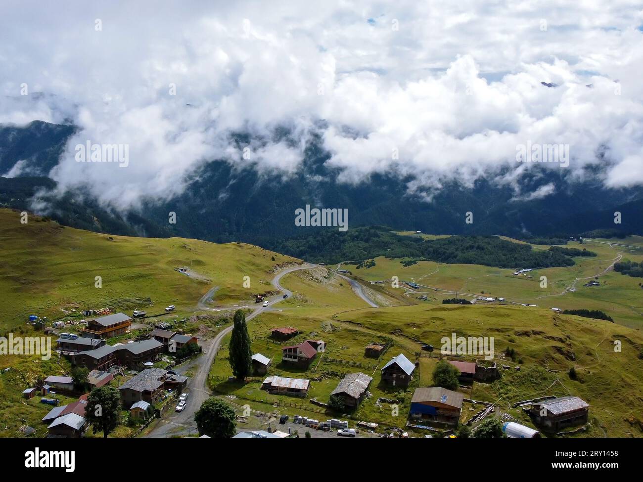 Aerial view of rural village Omalo in Georgia surrounded by mist high ...