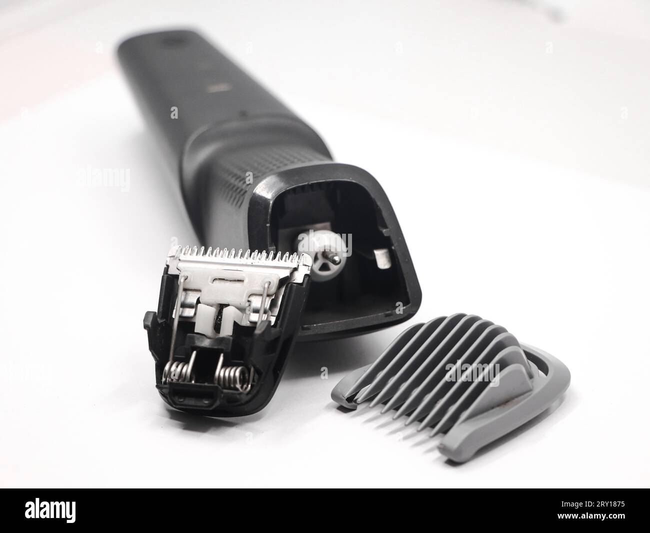shaver blade and handle parts of an electric hair trimmer disassembled ...