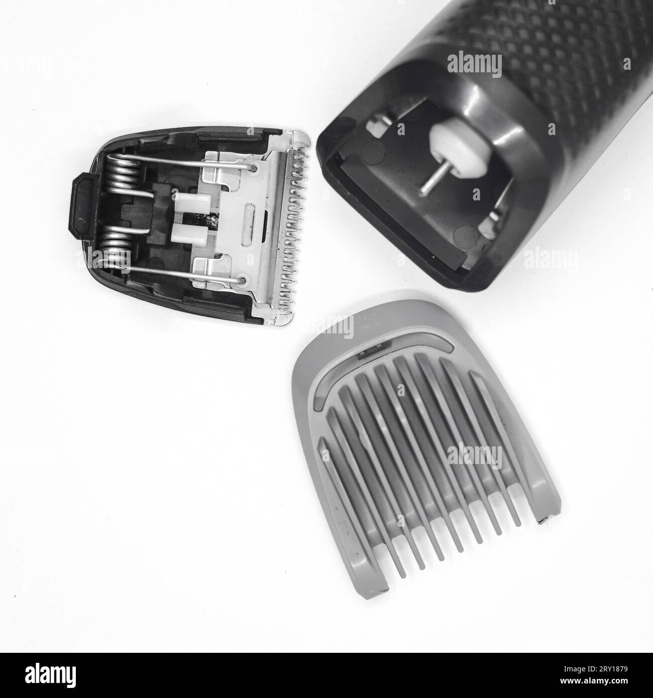 shaver blade and handle parts of an electric hair trimmer disassembled ...