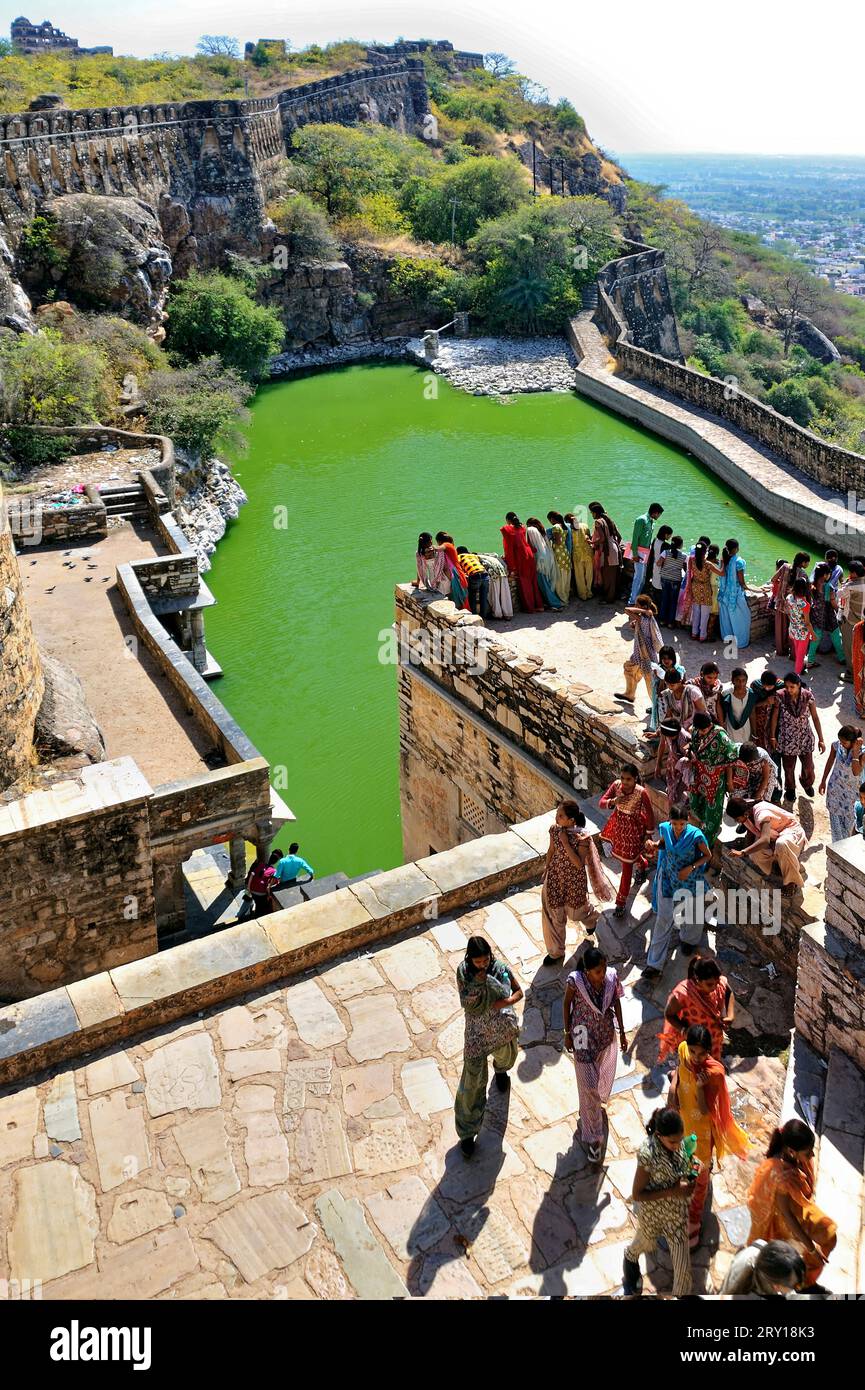 Pilgrim visiting holy place Gaumukh lake reservoir in Chittorgarh Fort ...