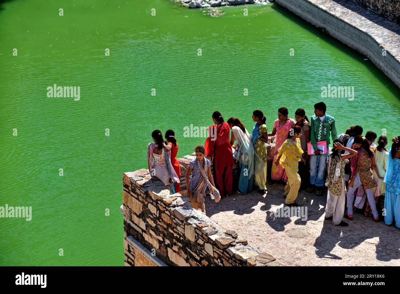Pilgrim visiting holy place Gaumukh lake reservoir in Chittorgarh Fort ...