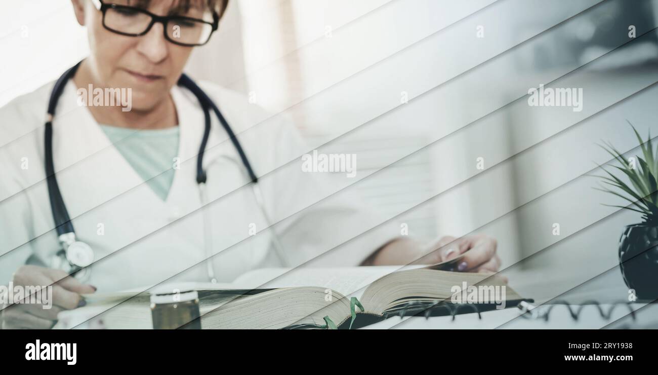 Female doctor reading a textbook in medical office, geometric pattern ...
