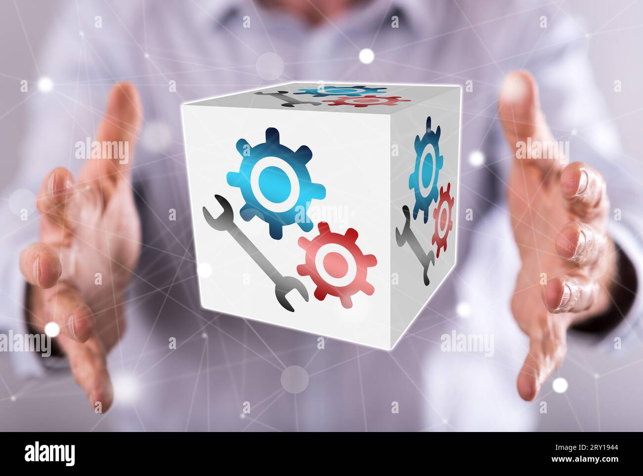 Maintenance system concept between hands of a man in background Stock ...