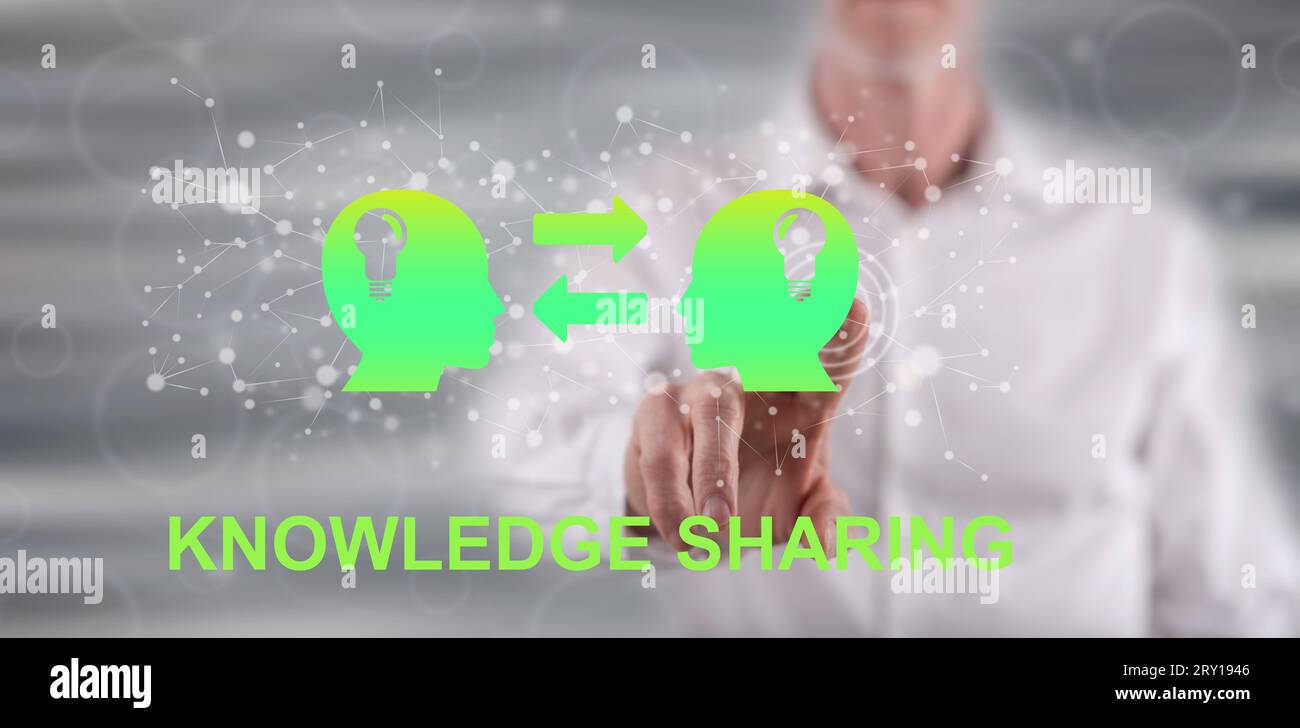 Man touching a knowledge sharing concept on a touch screen with his ...
