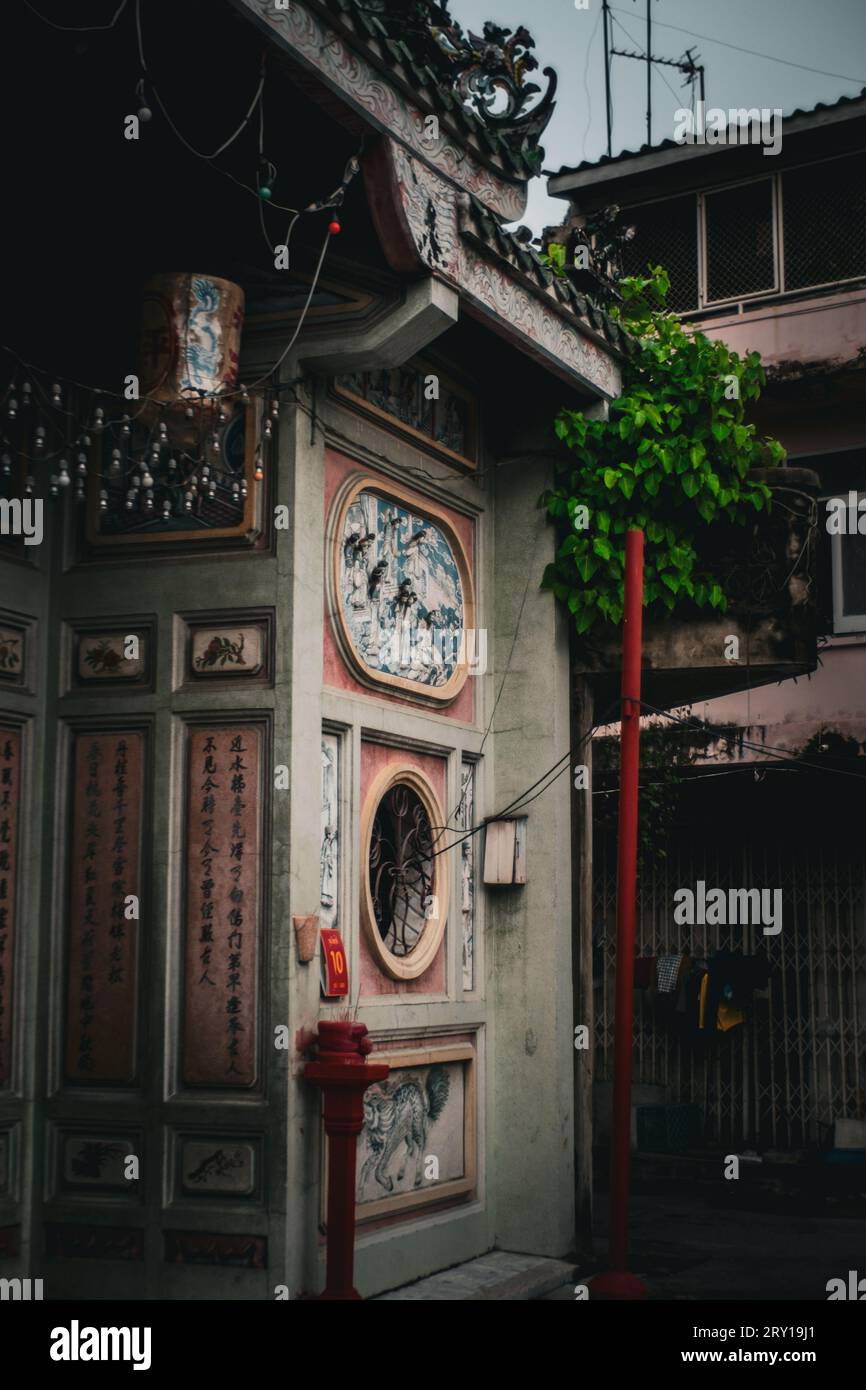 A vertical image of a Chinese temple in Bangkok. There is Chinese ...
