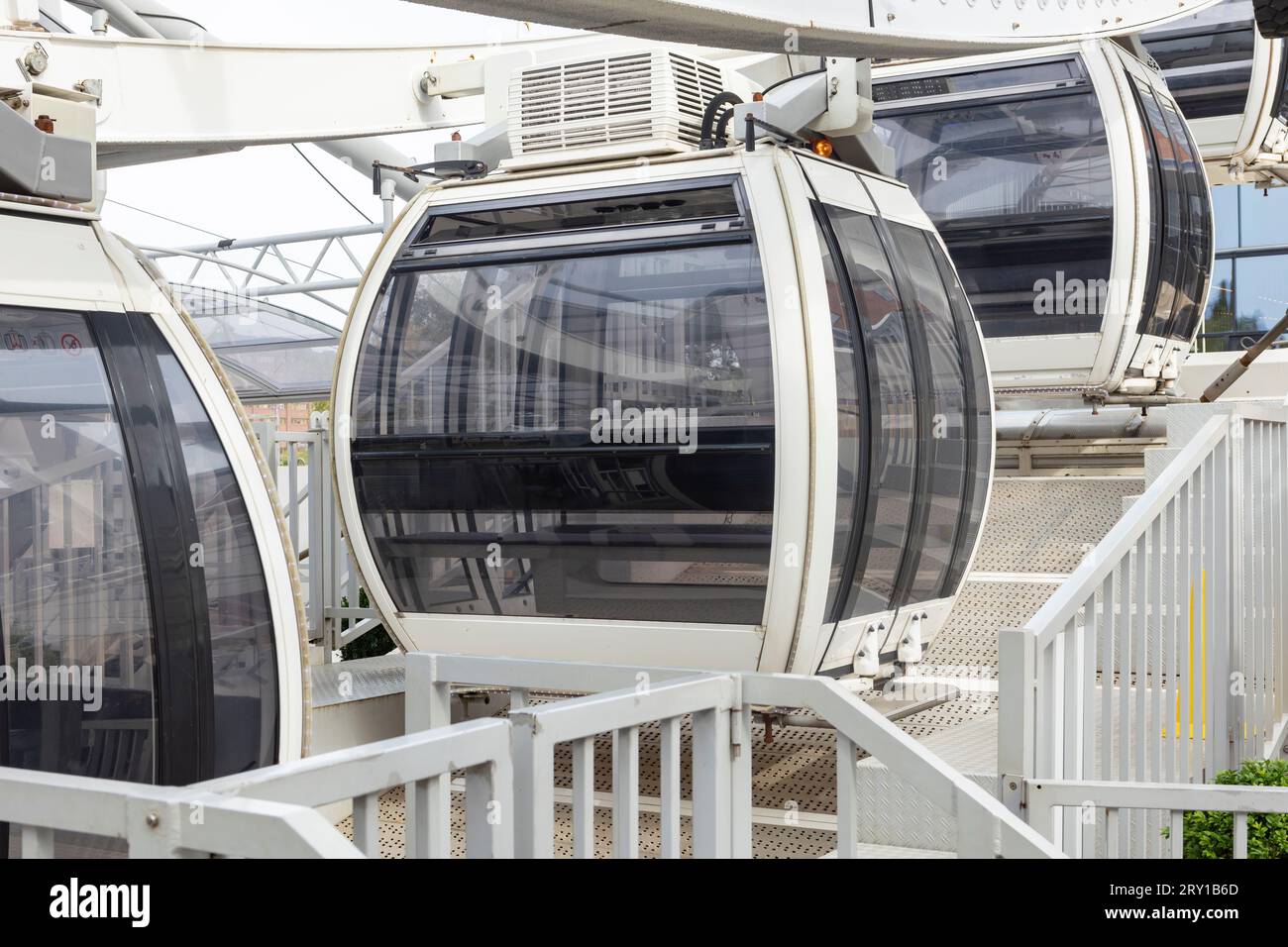 close up of passenger cabins on modern metal Ferris wheel in Amusement ...