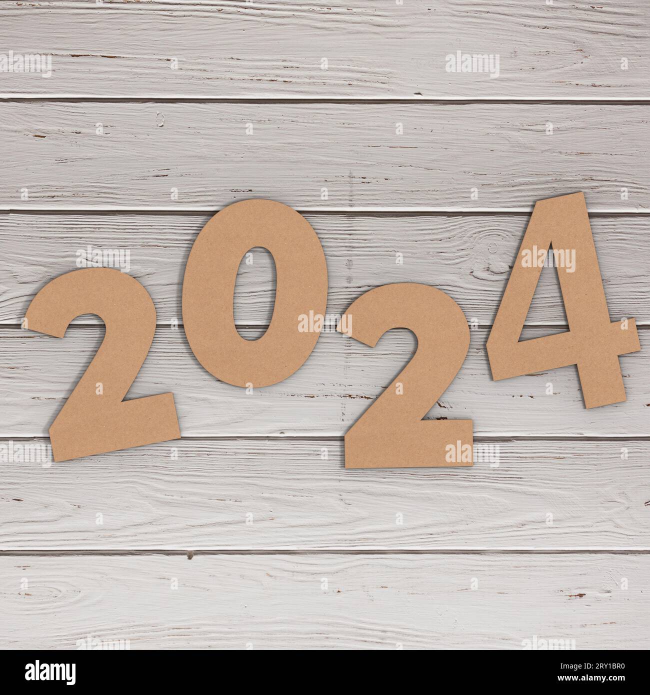 Cardstock Numbers 2024 Happy New Year Sign over wooden table background ...