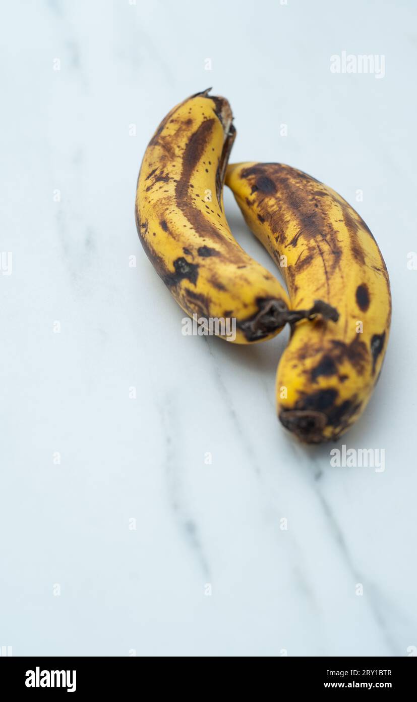black rotten bananas, rotten bananas on a white background. unhealthy ...