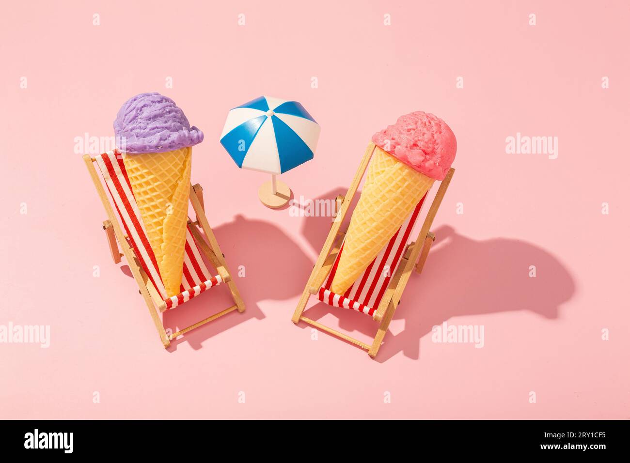 Ice cream in a hammock on a colored background, relaxation concept ...