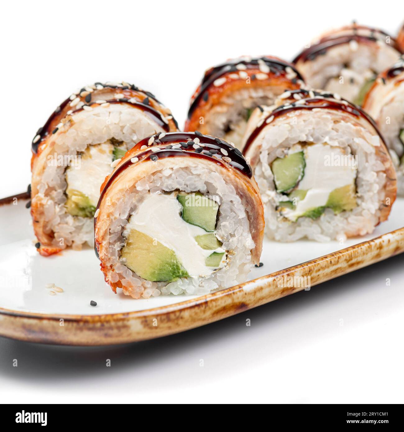 asian food - sushi roll with eel on plate on white background. Canada ...
