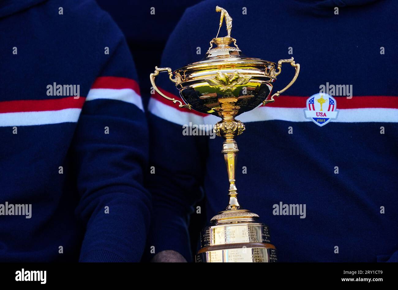 USA Captain Zach Johnson holds the Ryder Cup Trophy during a team group ...