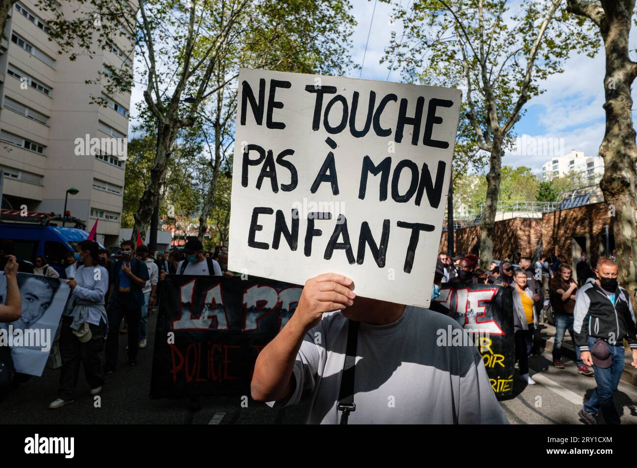 A demonstrator holding a " Touch not my child " sign Stock Photo - Alamy