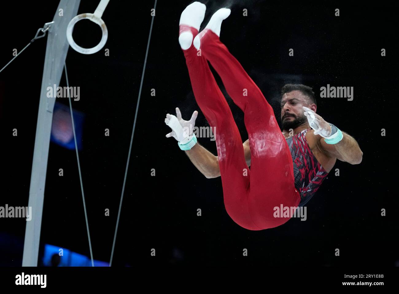 Egypt's Ahmed Elmaraghy practices on the rings during podium training ...