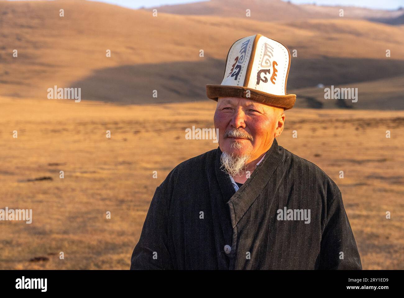 Kyrgyz man in traditional dress near his yurt kyrgyzstan Stock Photo ...