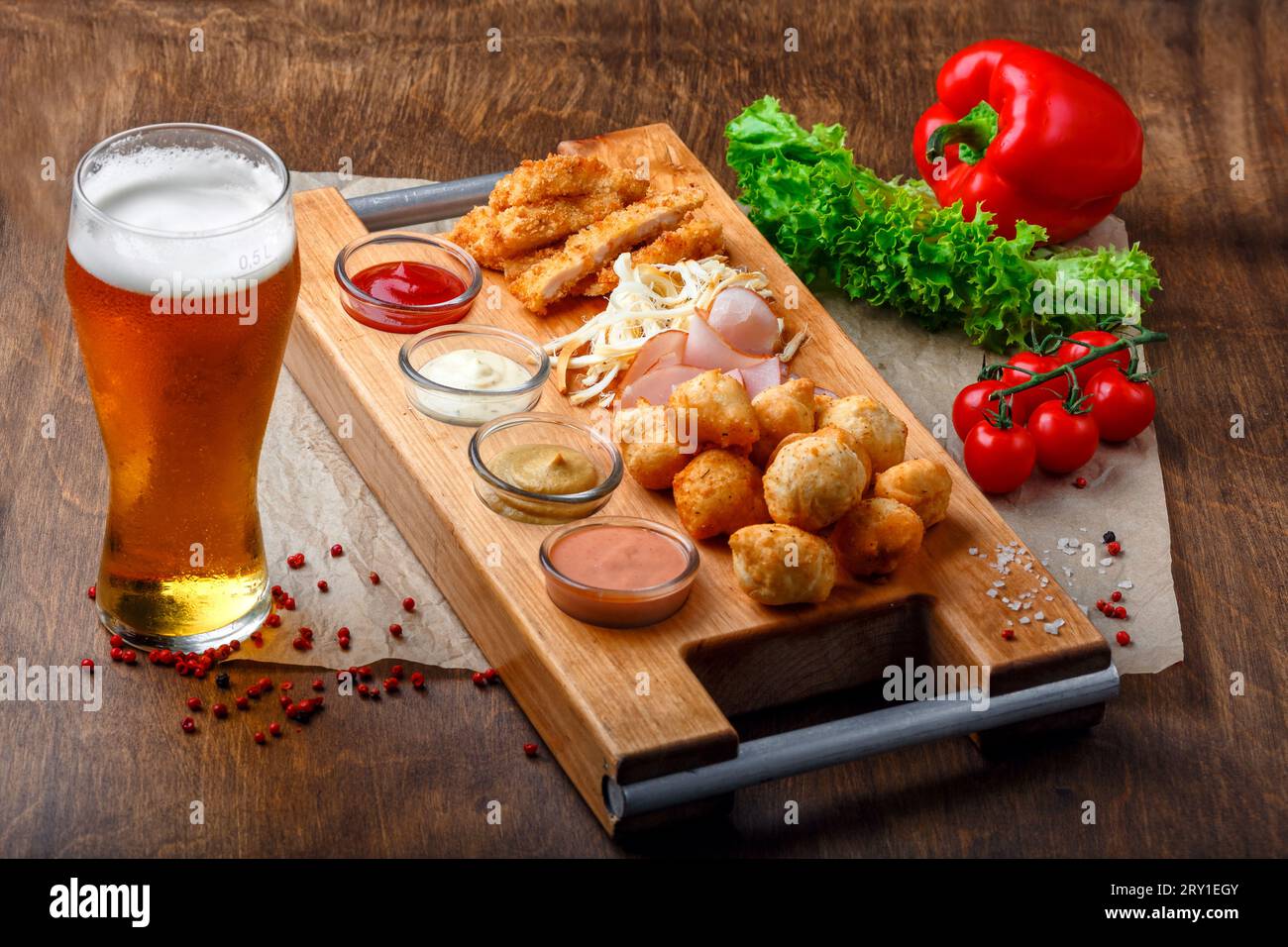 Big set of snacks for beer it includes fried cheese balls, pigtail ...