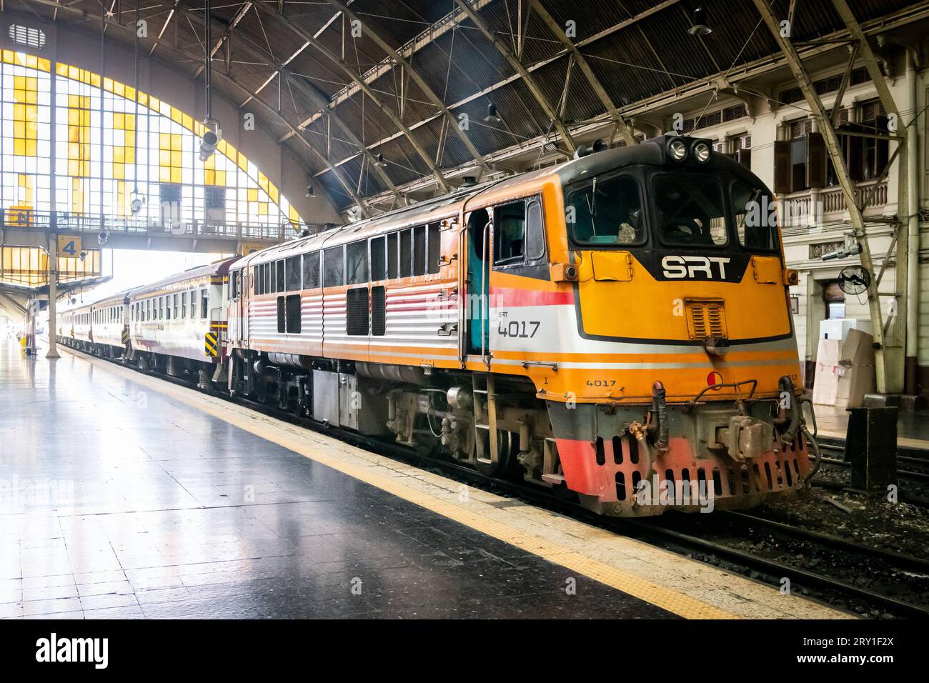 A train engine pulls into the platform with the driver working at Hua ...