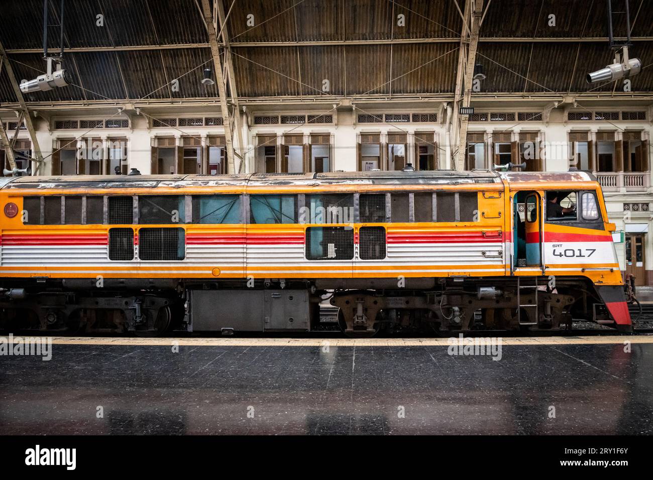 A train engine pulls into the platform with the driver working at Hua ...