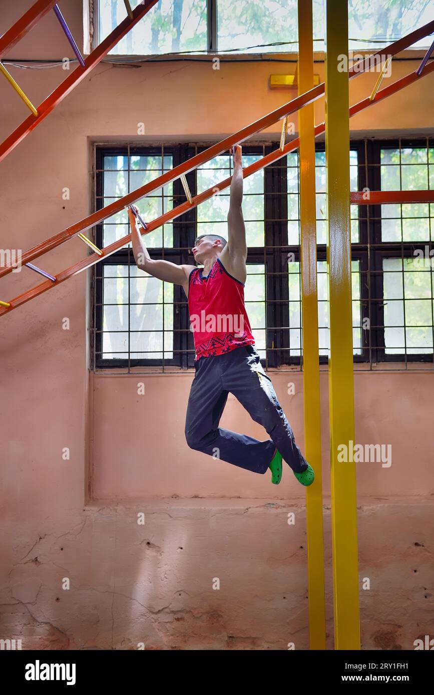 Muscular Man Climbs Ladder At Gym. Extreme and healthy lifestyle ...