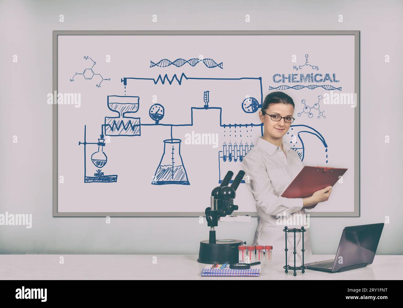 Woman scientific researcher in laboratory and billboard with drawing ...