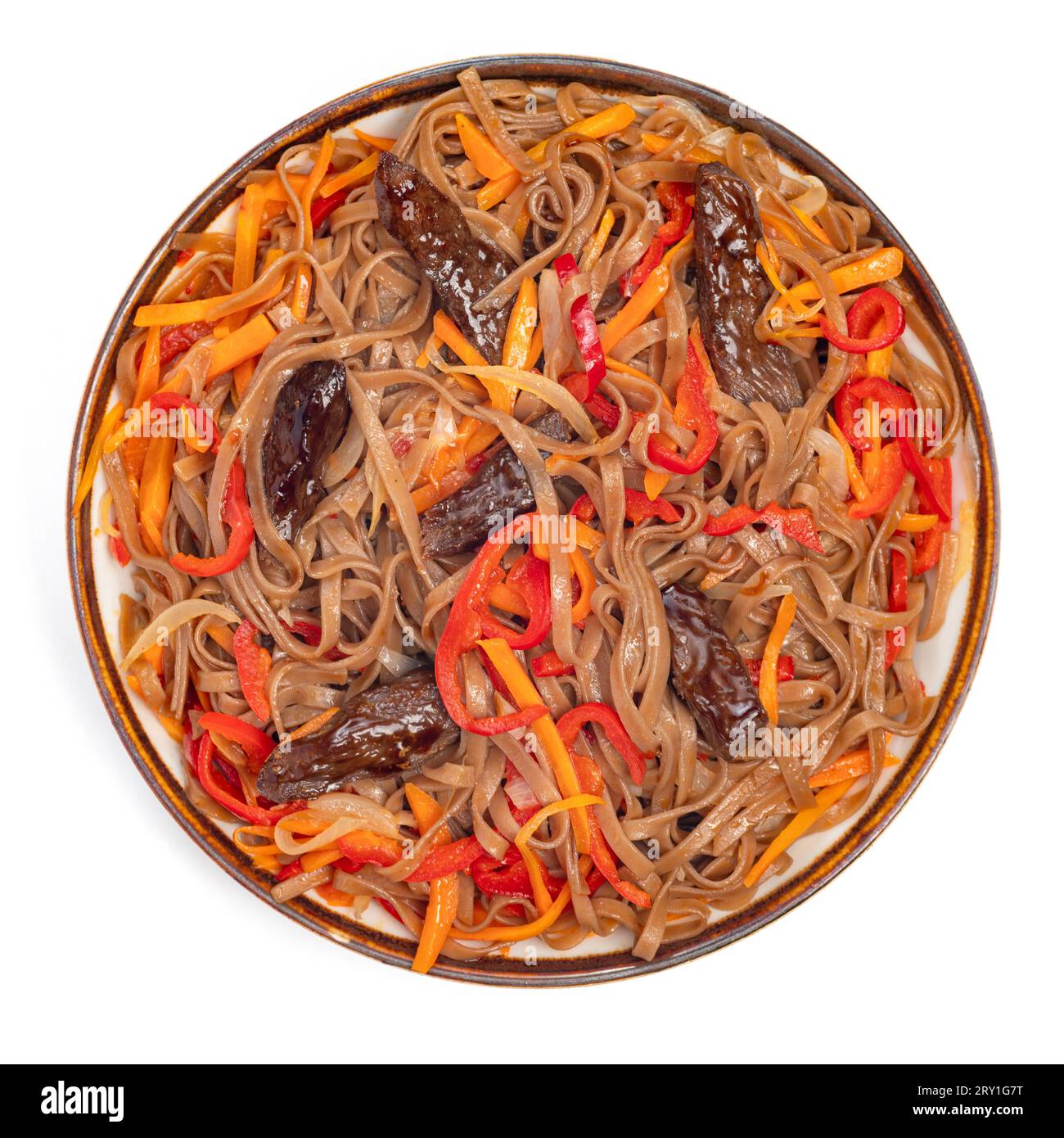 Asian fried buckwheat noodles with Beef and vegetables isolated on ...