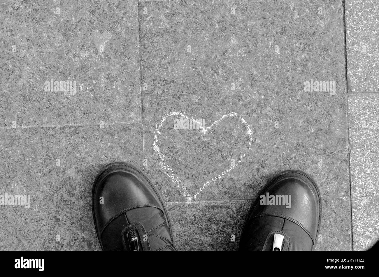 A heart drawn on the ground. The image captures an intriguing scene of ...